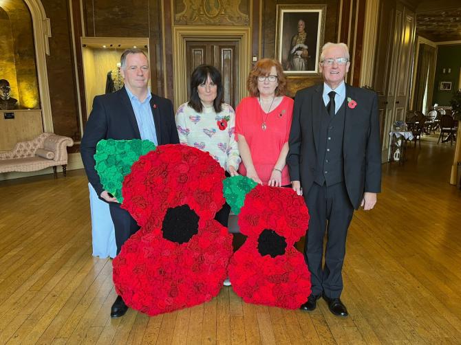 Talented trio present knitted poppies to Brownlow House - Your Lurgan